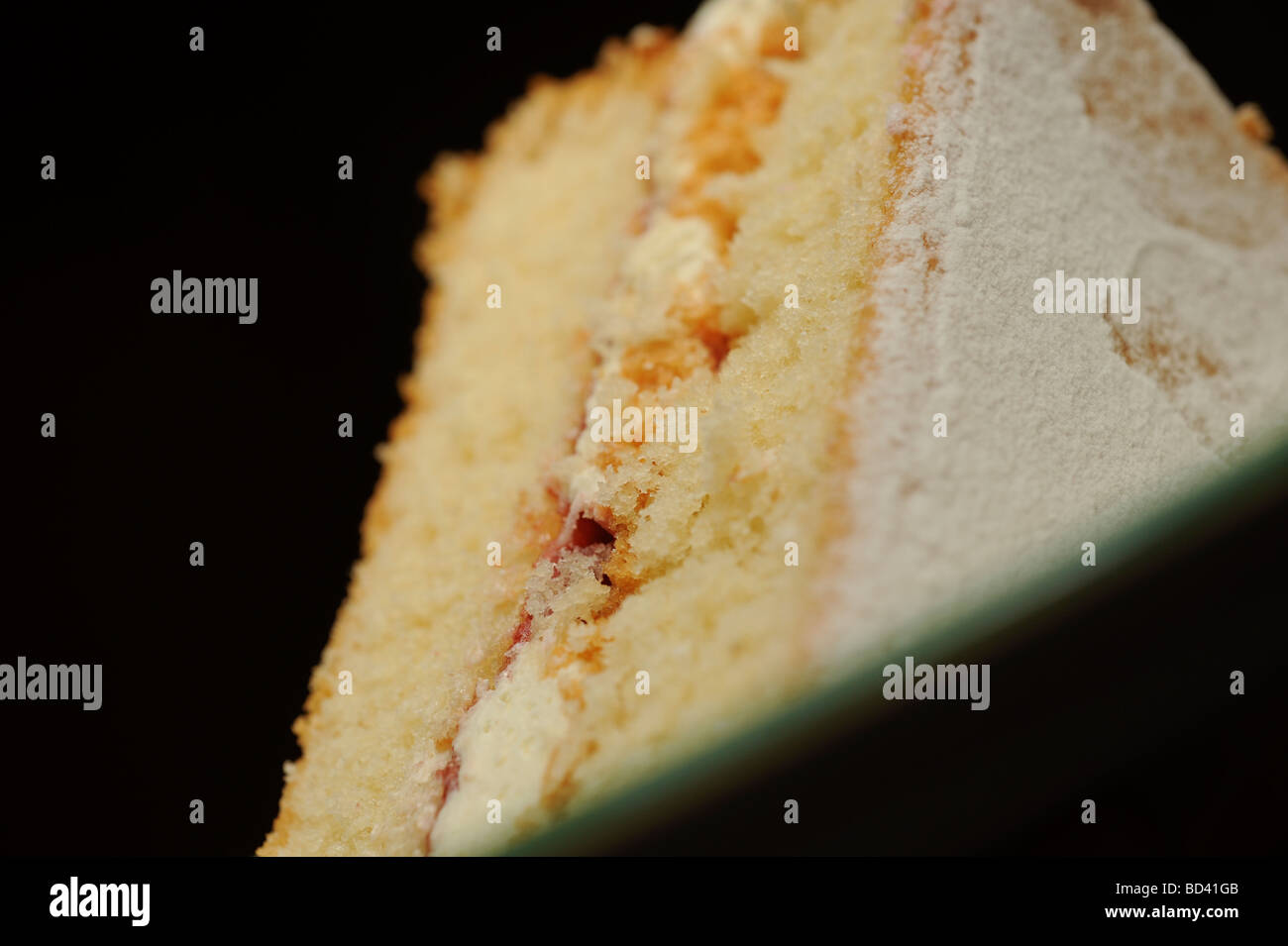A slice of Victoria sponge cake Stock Photo - Alamy