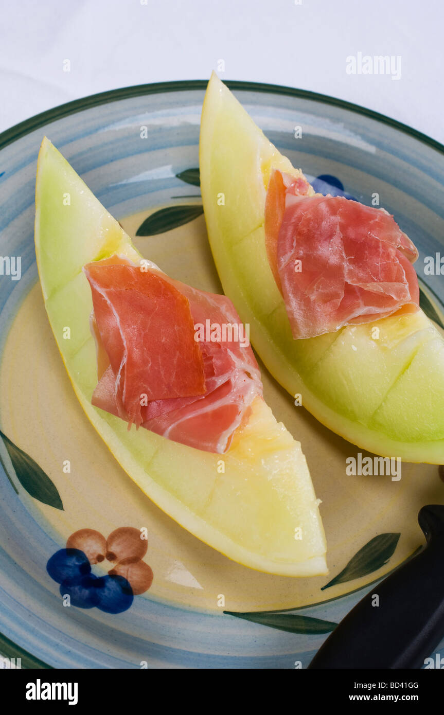 Slices of melon with parma ham Stock Photo - Alamy