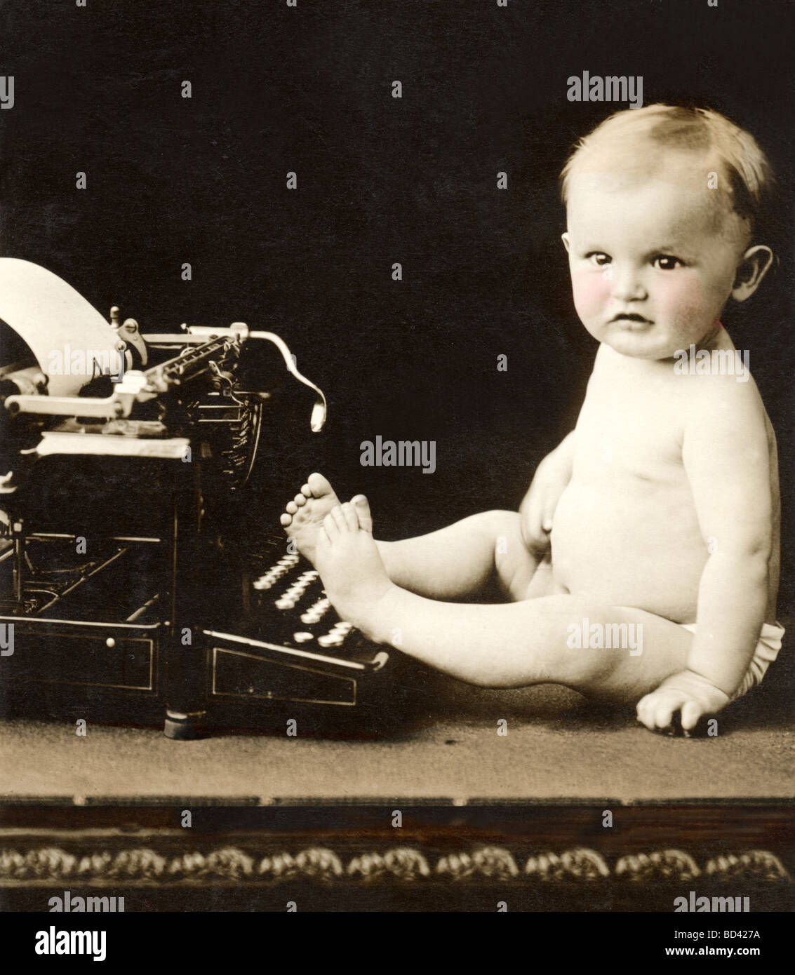 Baby Typing with Feet on Typewriter Stock Photo - Alamy