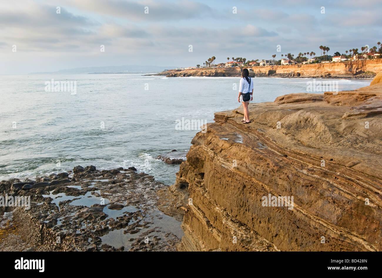 A woman enjoying the views of Sunset Cliffs Stock Photo - Alamy