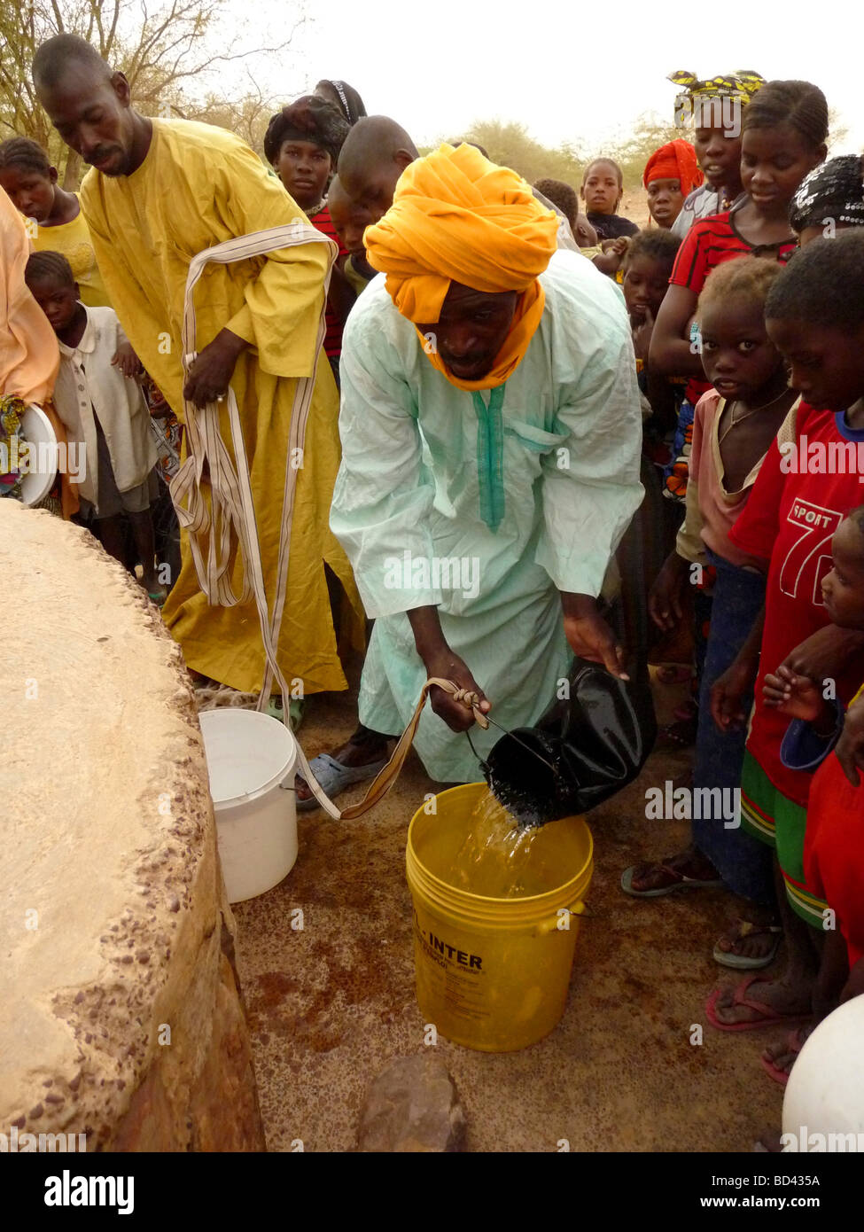 A village chief demonstrating how the water well works Stock Photo - Alamy