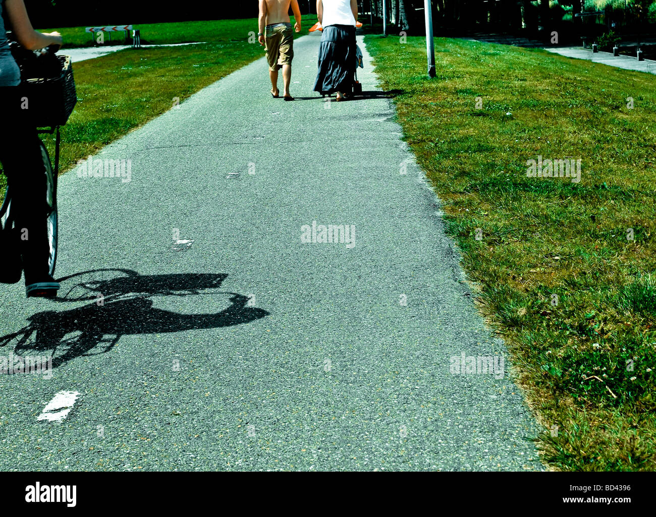 Foot path with people walking by Stock Photo - Alamy