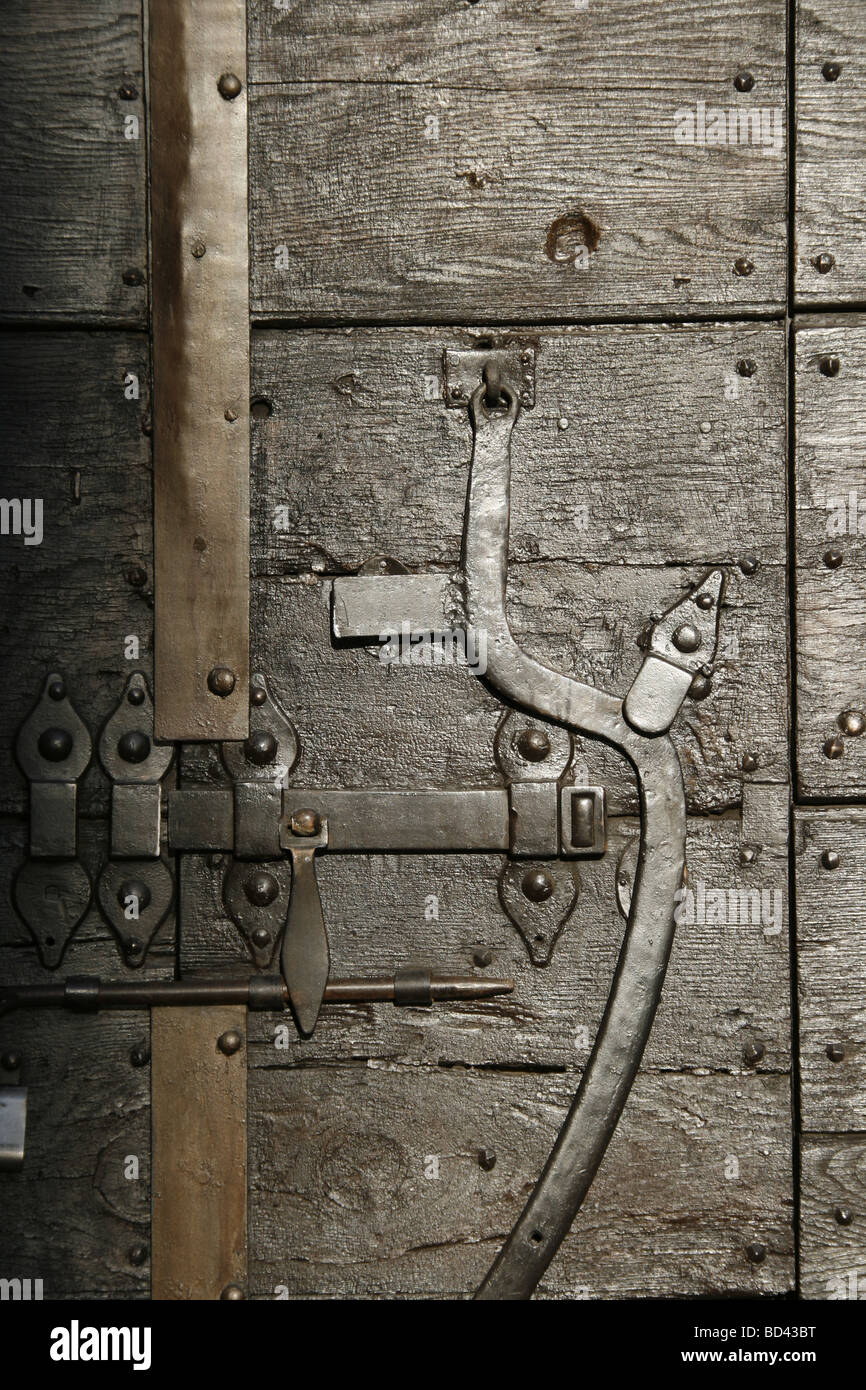 intricate metal lock system on big wooden door Stock Photo - Alamy