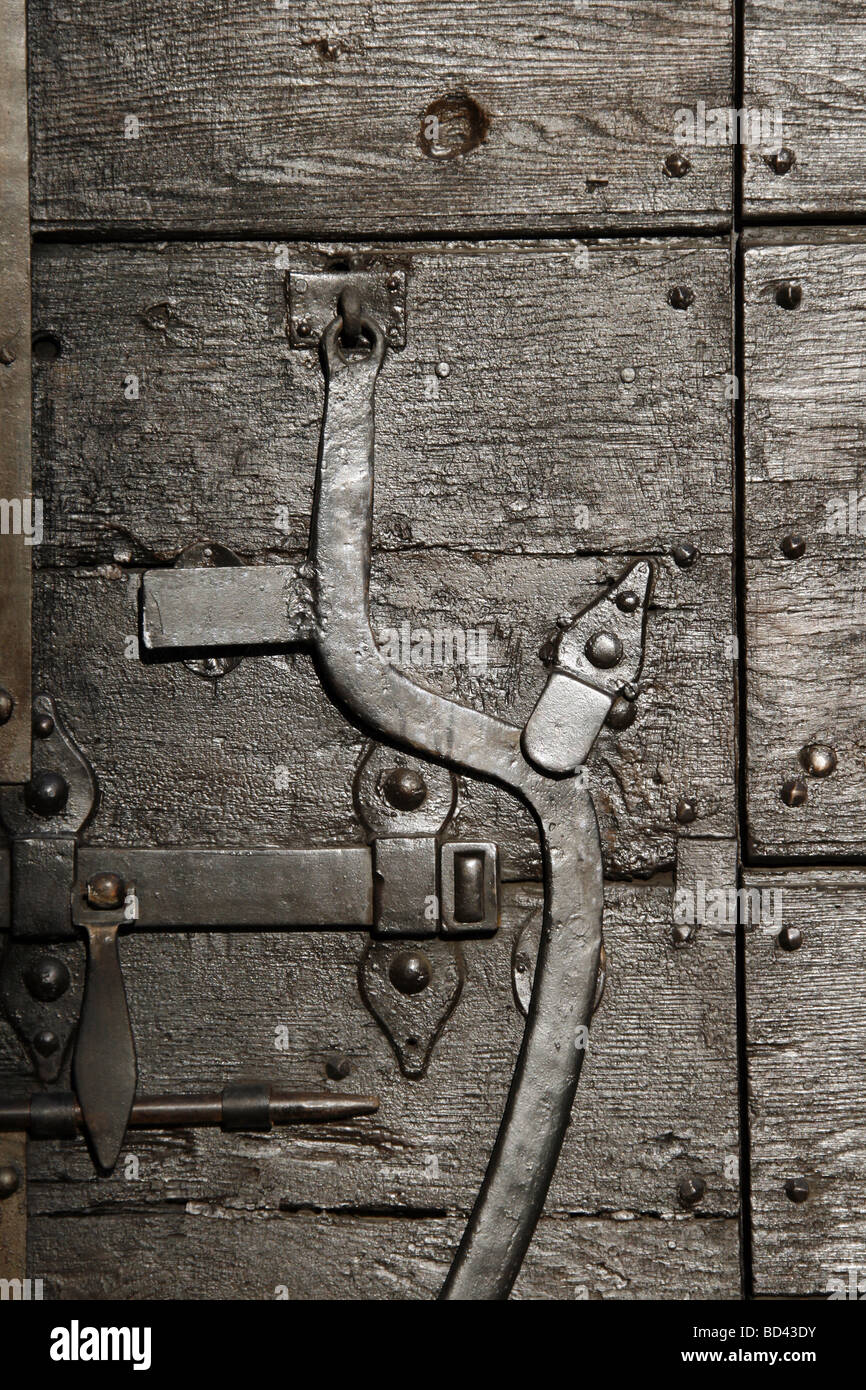 intricate metal lock system on big wooden door Stock Photo - Alamy