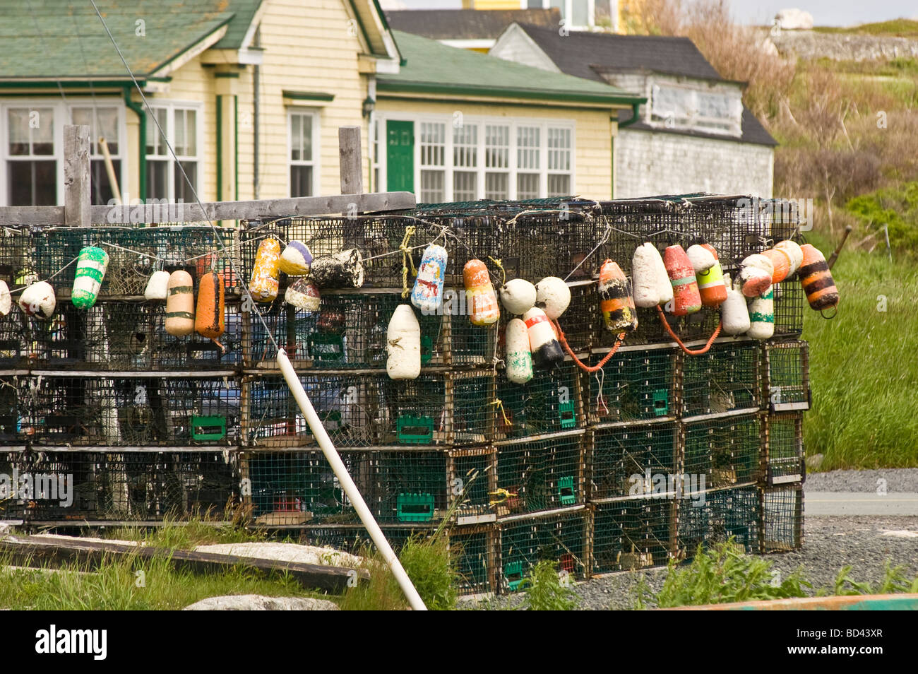 Colorful fisherman buoys and lobster pots, cages, nets in Peggy's cove ...