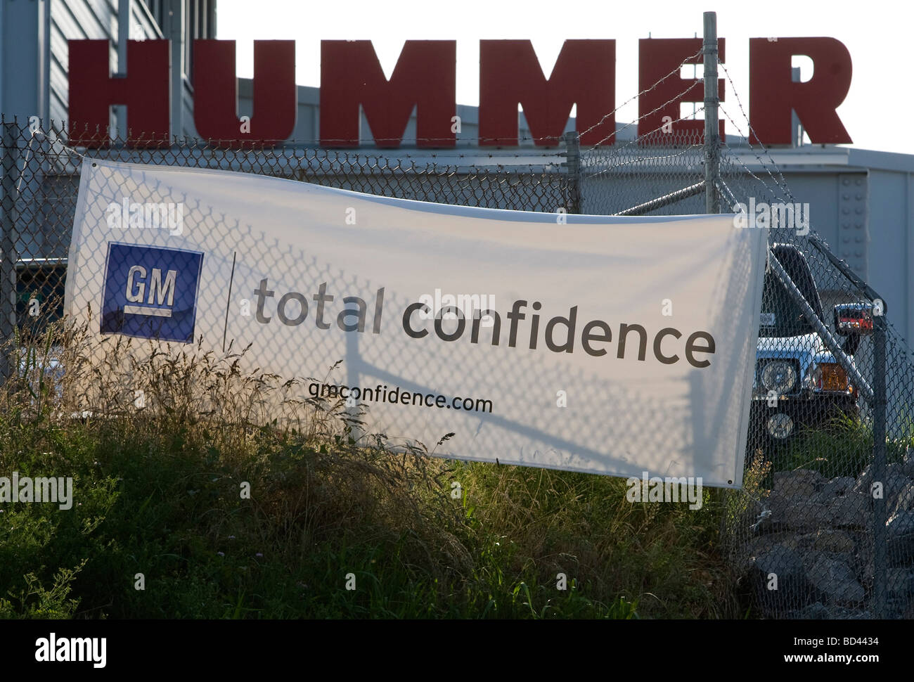 A General Motors “Total Confidence” banner hangs in front of a suburban ...