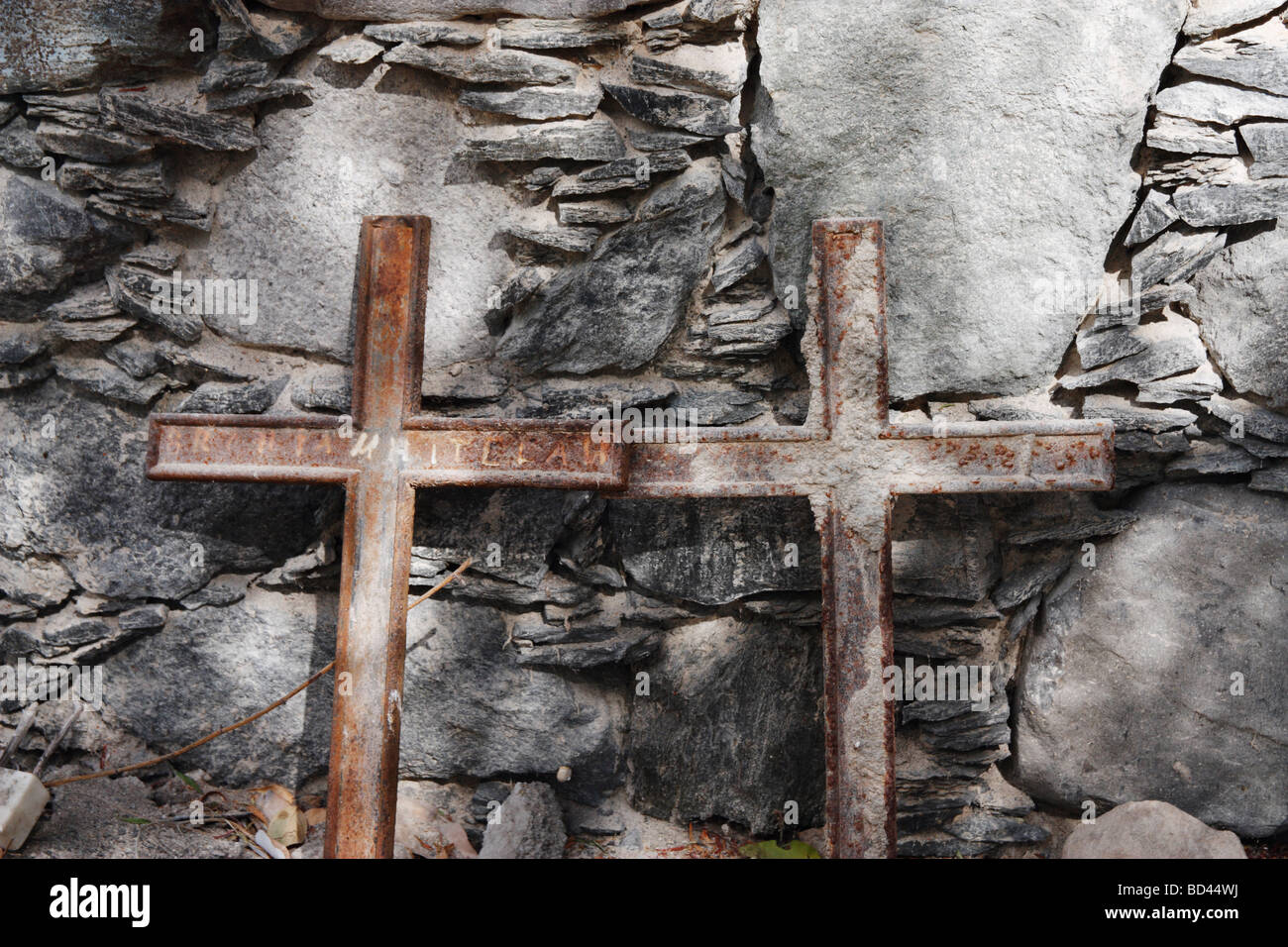 Rusty, rusting steel crosses in cemetery Stock Photo - Alamy