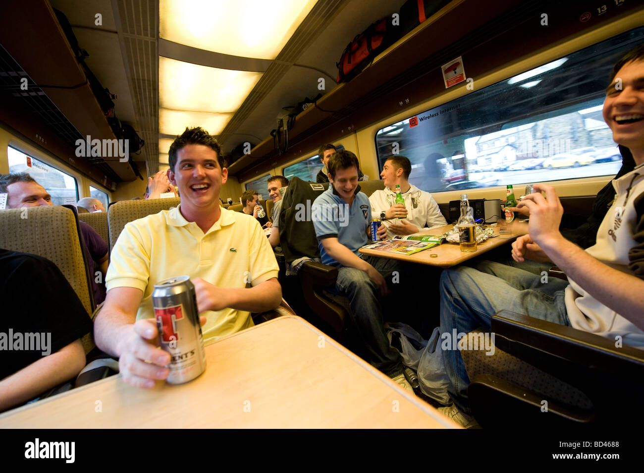 Young white European males celebrating on a train journey Stock Photo ...