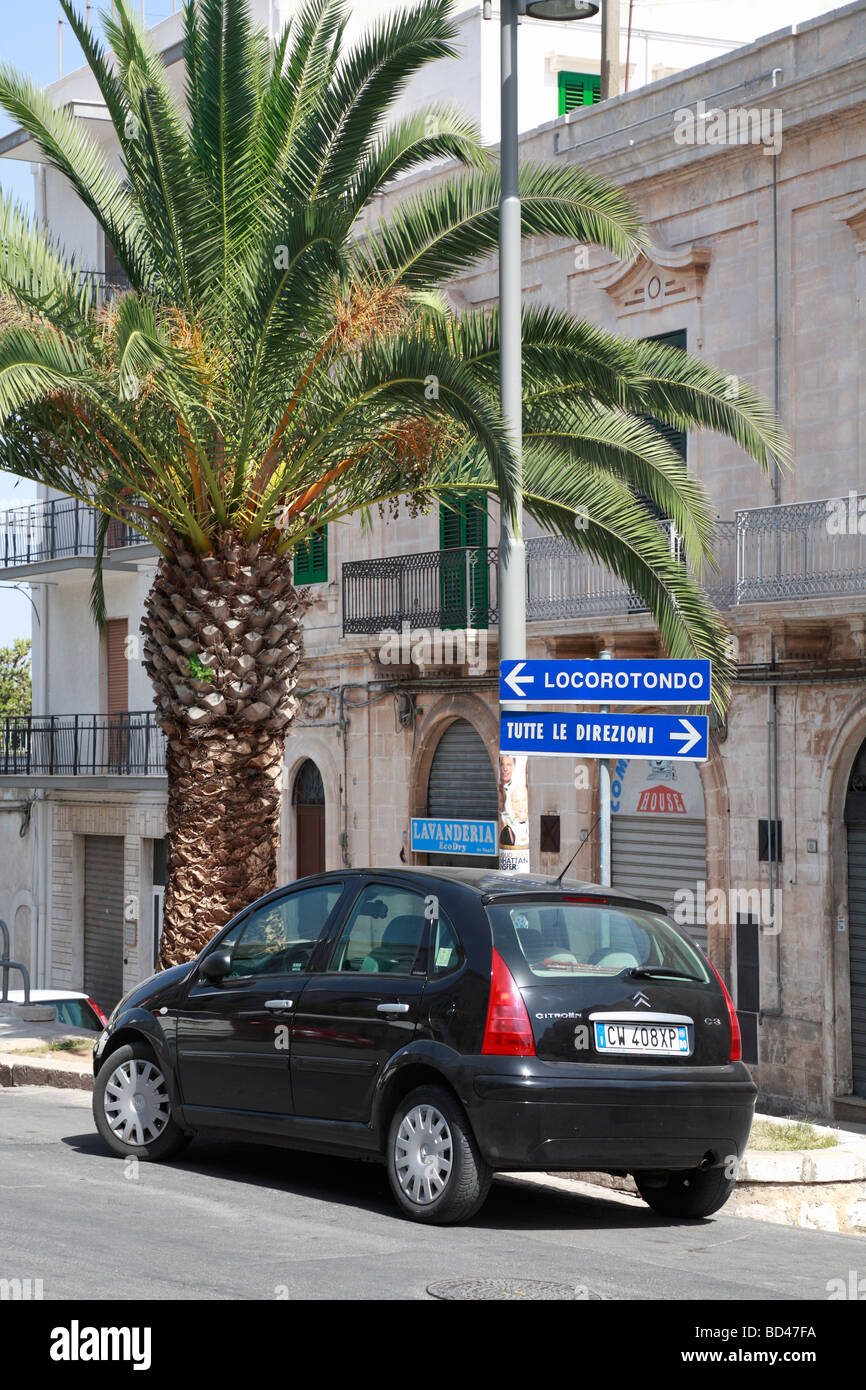 Car parked by road traffic signs, Cisternino, Puglia, Italy Stock Photo ...
