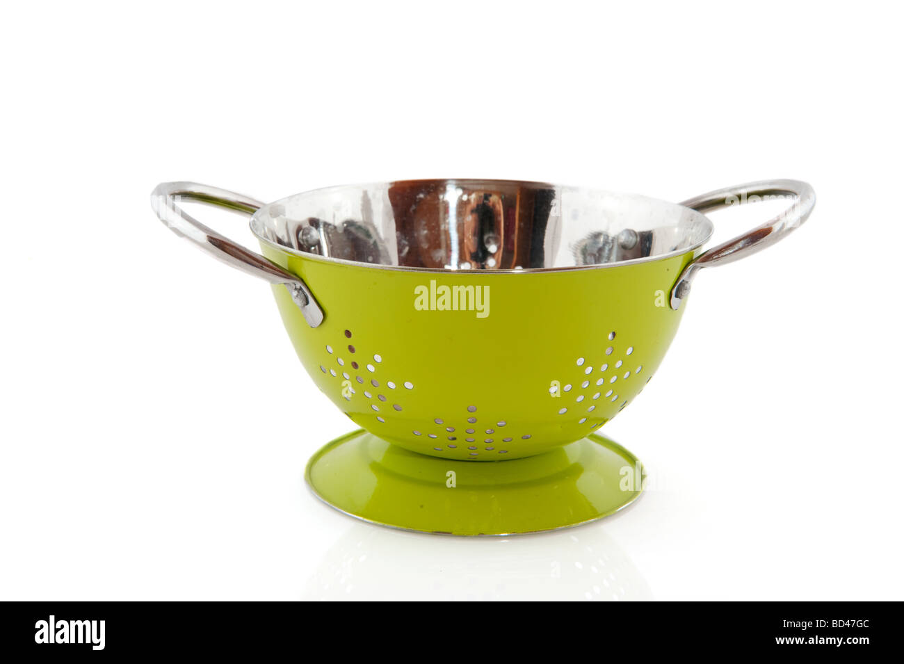 Green colander as kitchen equipment isolated over white Stock Photo - Alamy