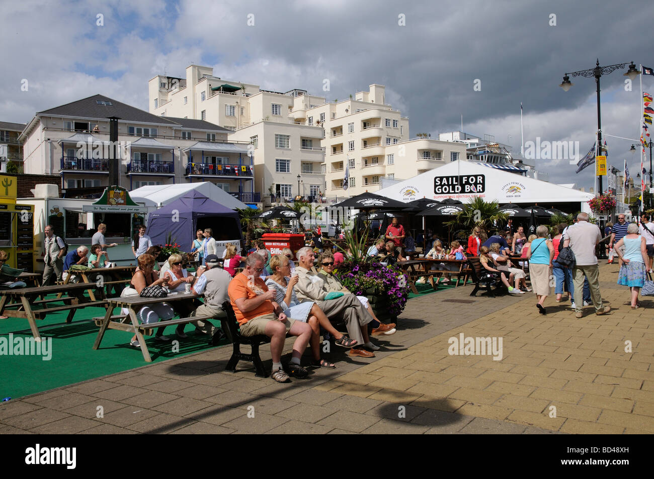 Cowes regatta week visitors relaxing on The Parade a waterfront area of ...