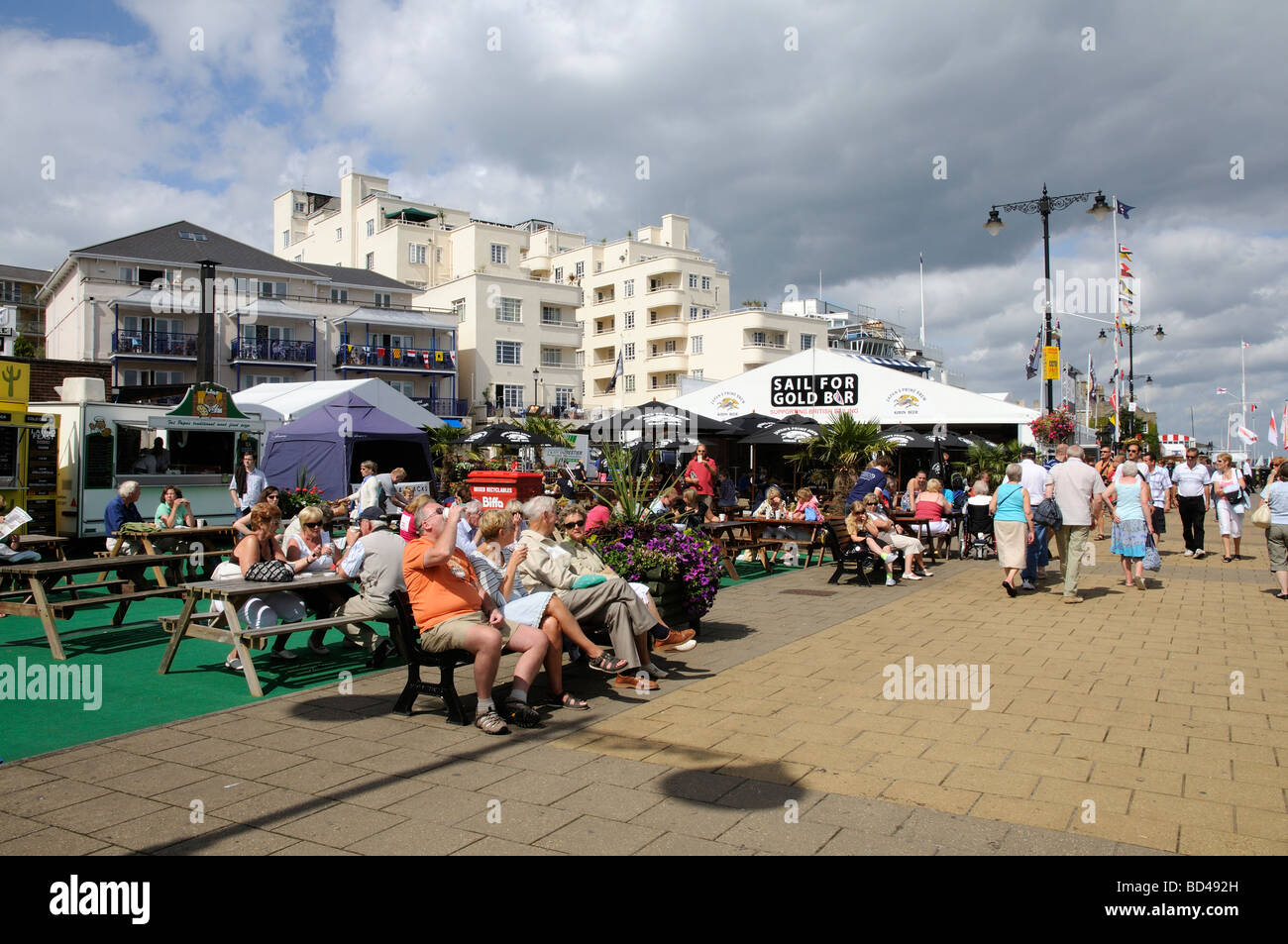 Cowes regatta week visitors relaxing on The Parade a waterfront area of ...