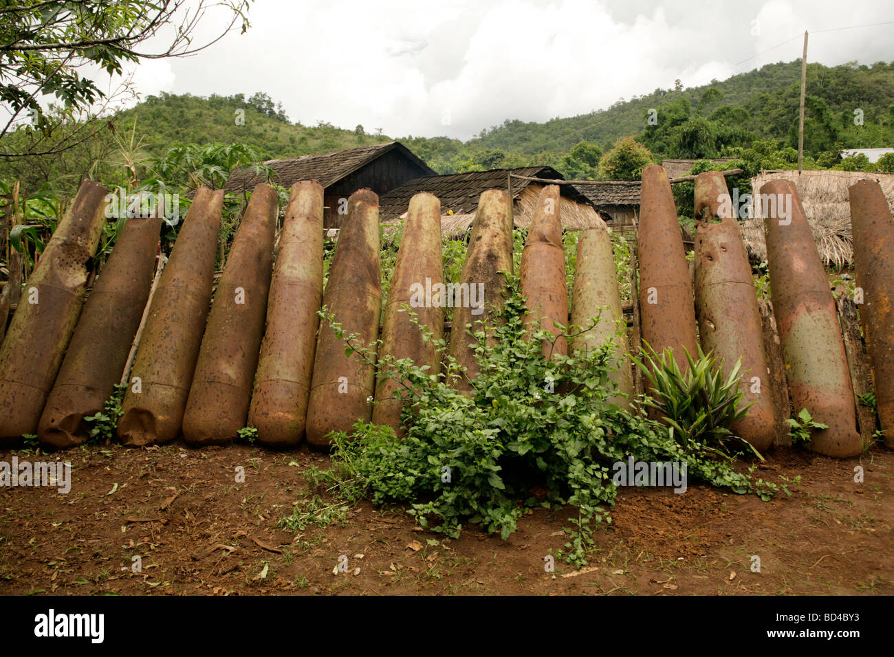Xieng Khouang, Laos, 2006 : a farmer has collected cluster bomb casing ...
