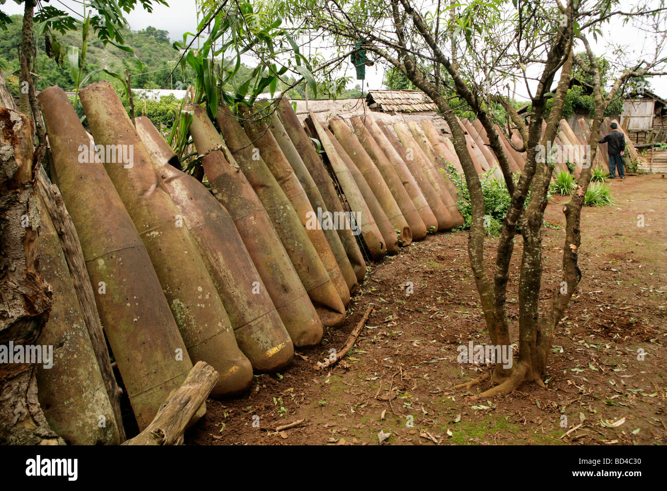 Xieng Khouang, Laos, 2006 : a farmer has collected cluster bomb casing ...