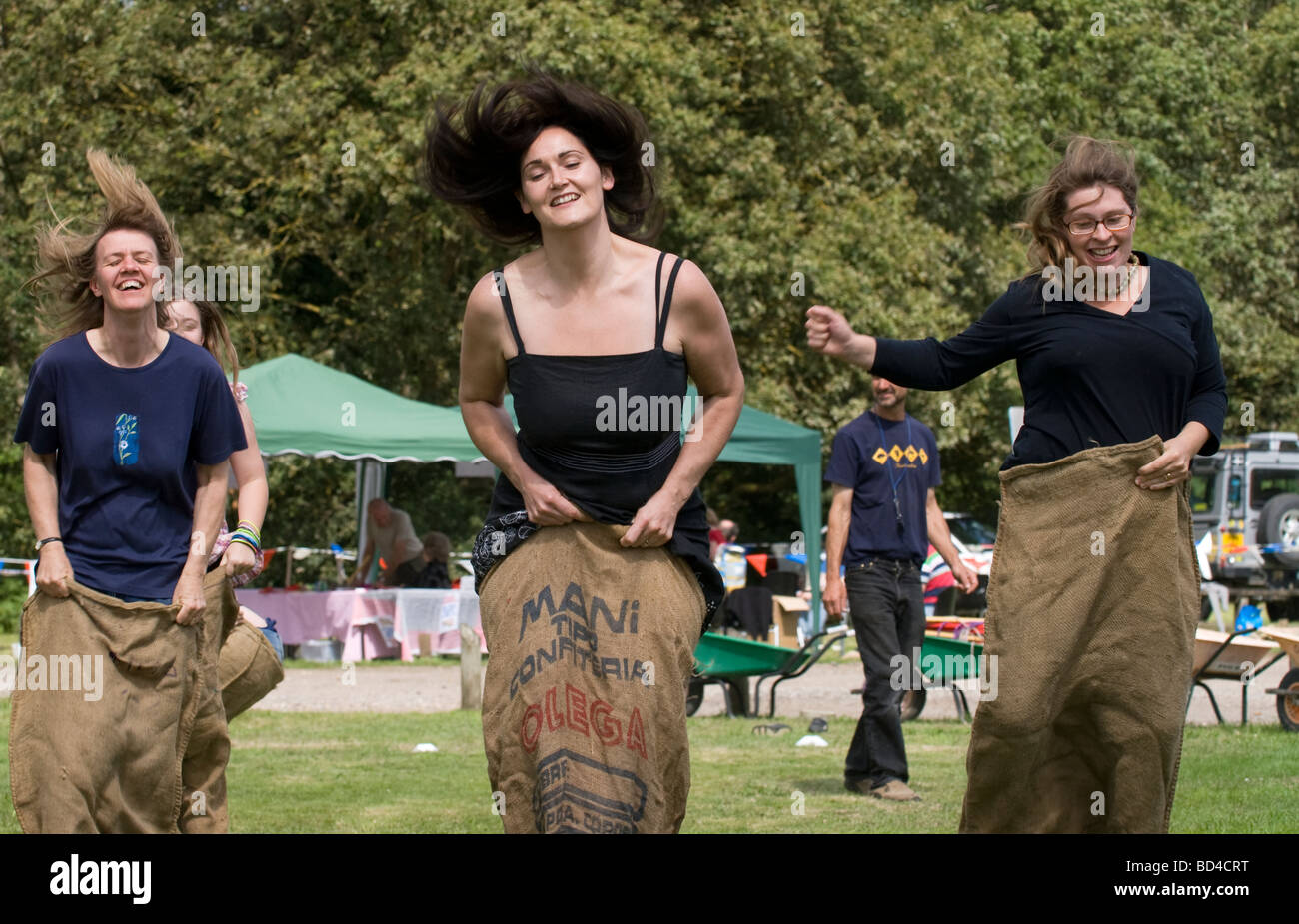 Women taking part in sack race at Oakhanger Village Show, Hampshire, UK ...