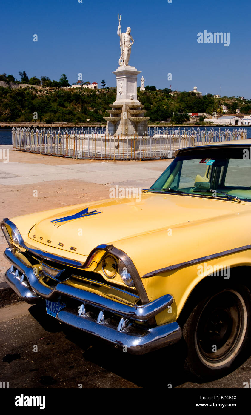 Classic Dodge 50s auto in front of river and statues with Christ statue ...