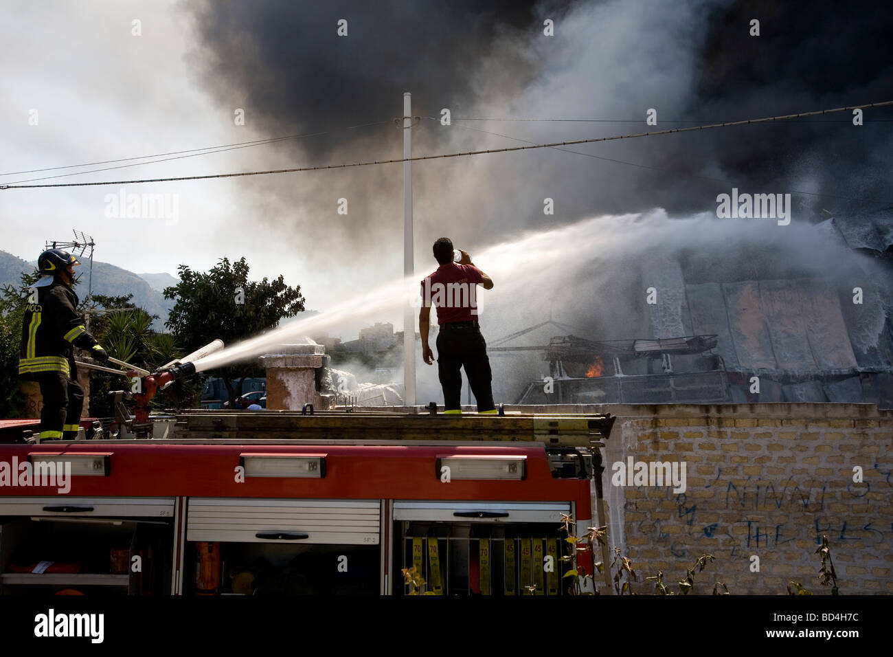 Firefighters at work Stock Photo - Alamy