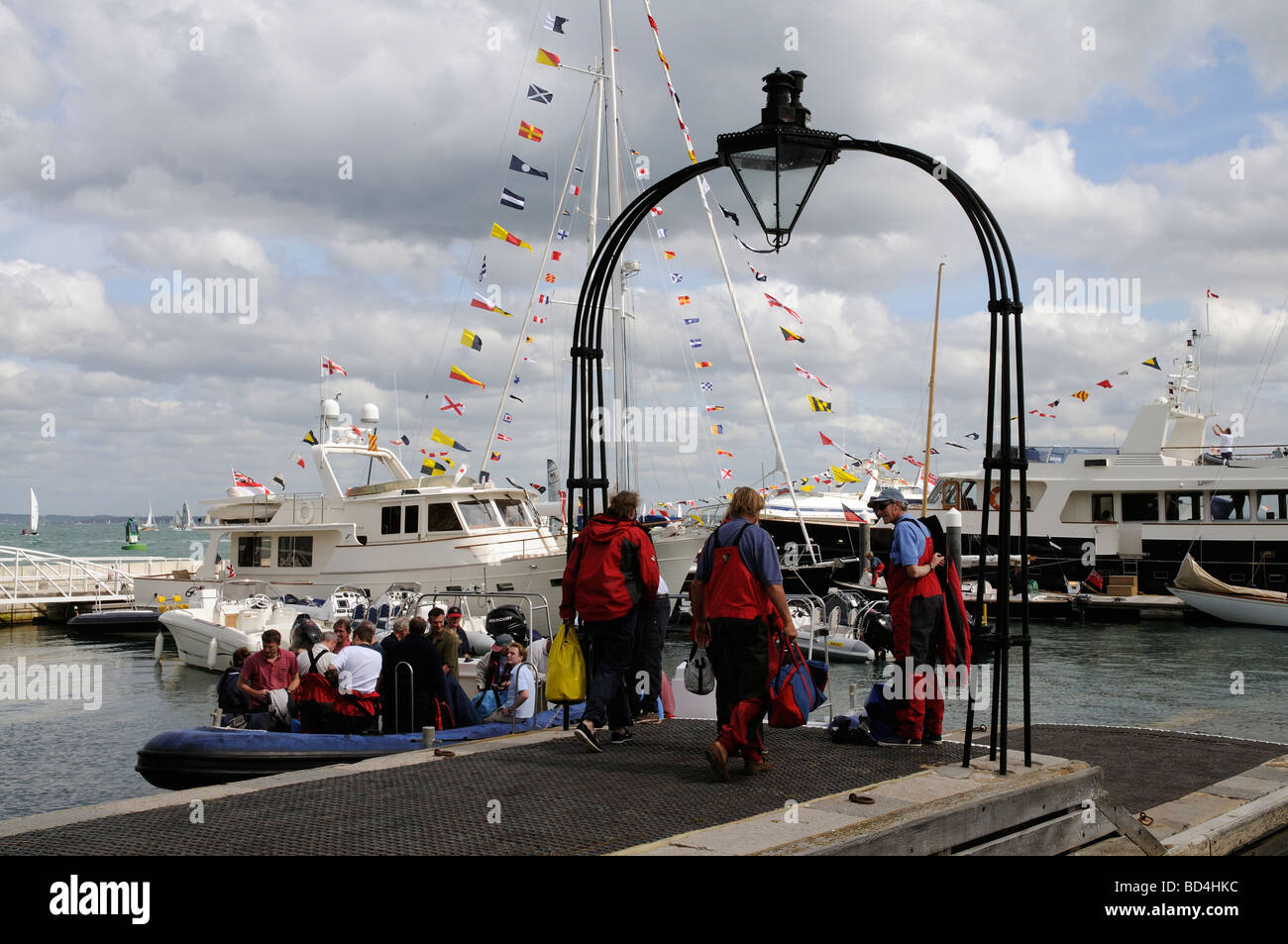 Cowes regatta week visiting sailors yachtsmen on the RYS landing stage ...