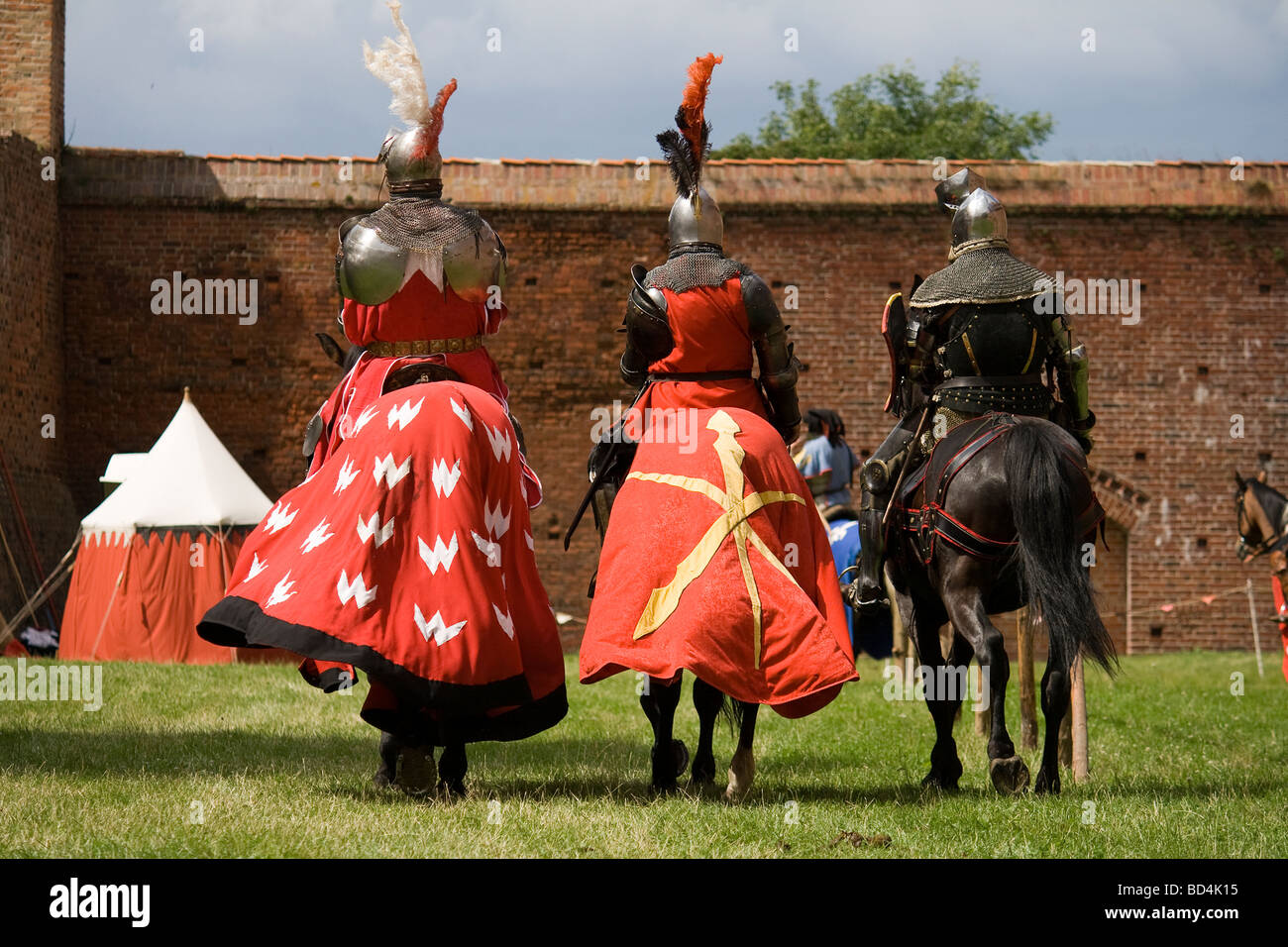 Medieval cavalry knights on military horses presenting themselves to ...