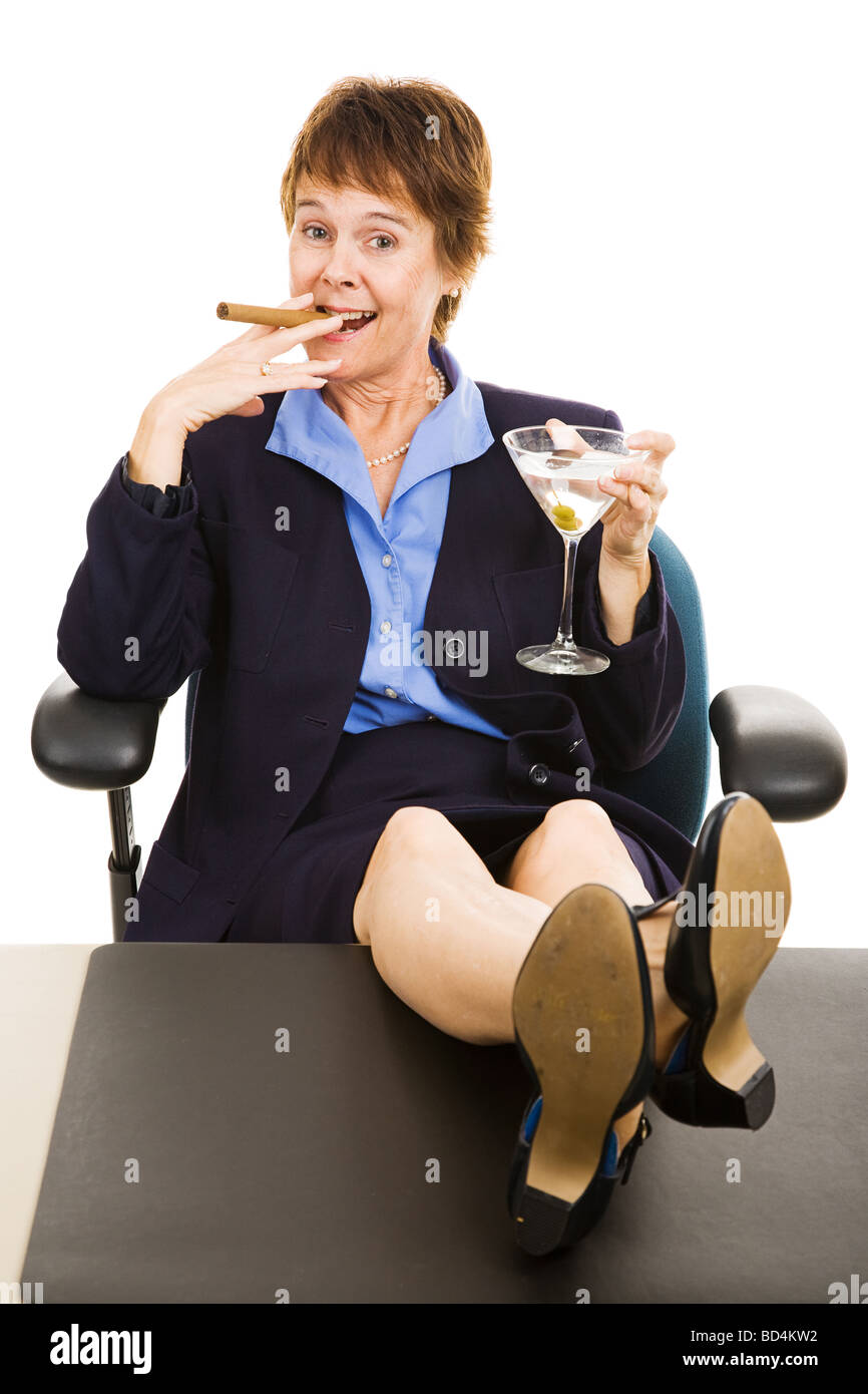 Successful business woman relaxing with a cocktail and a cigar Isolated ...