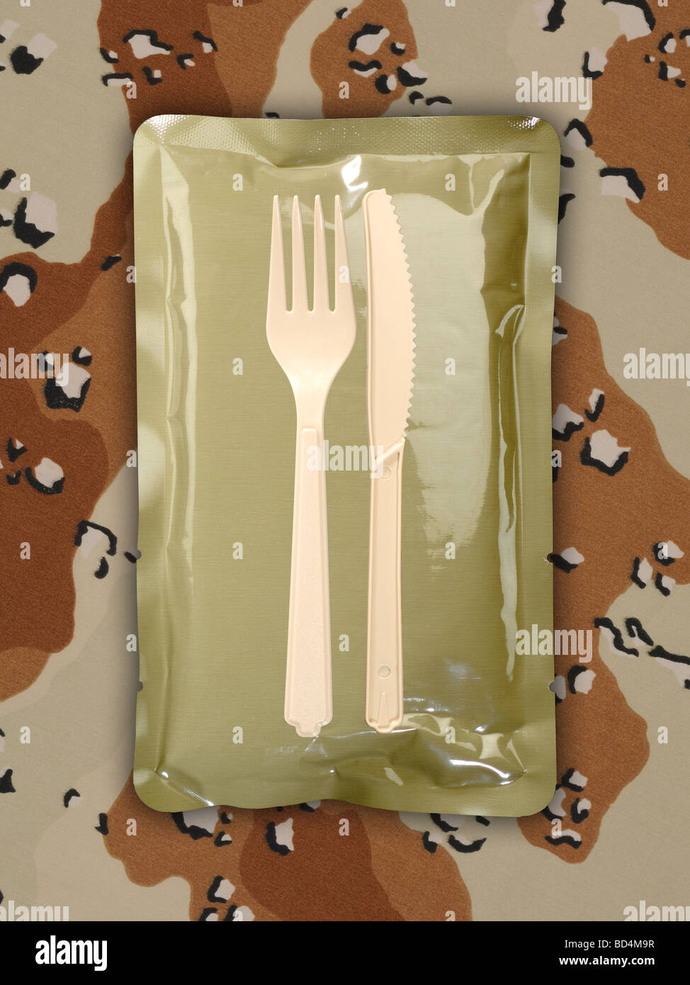 One military food ration package with eating utensils on a background ...