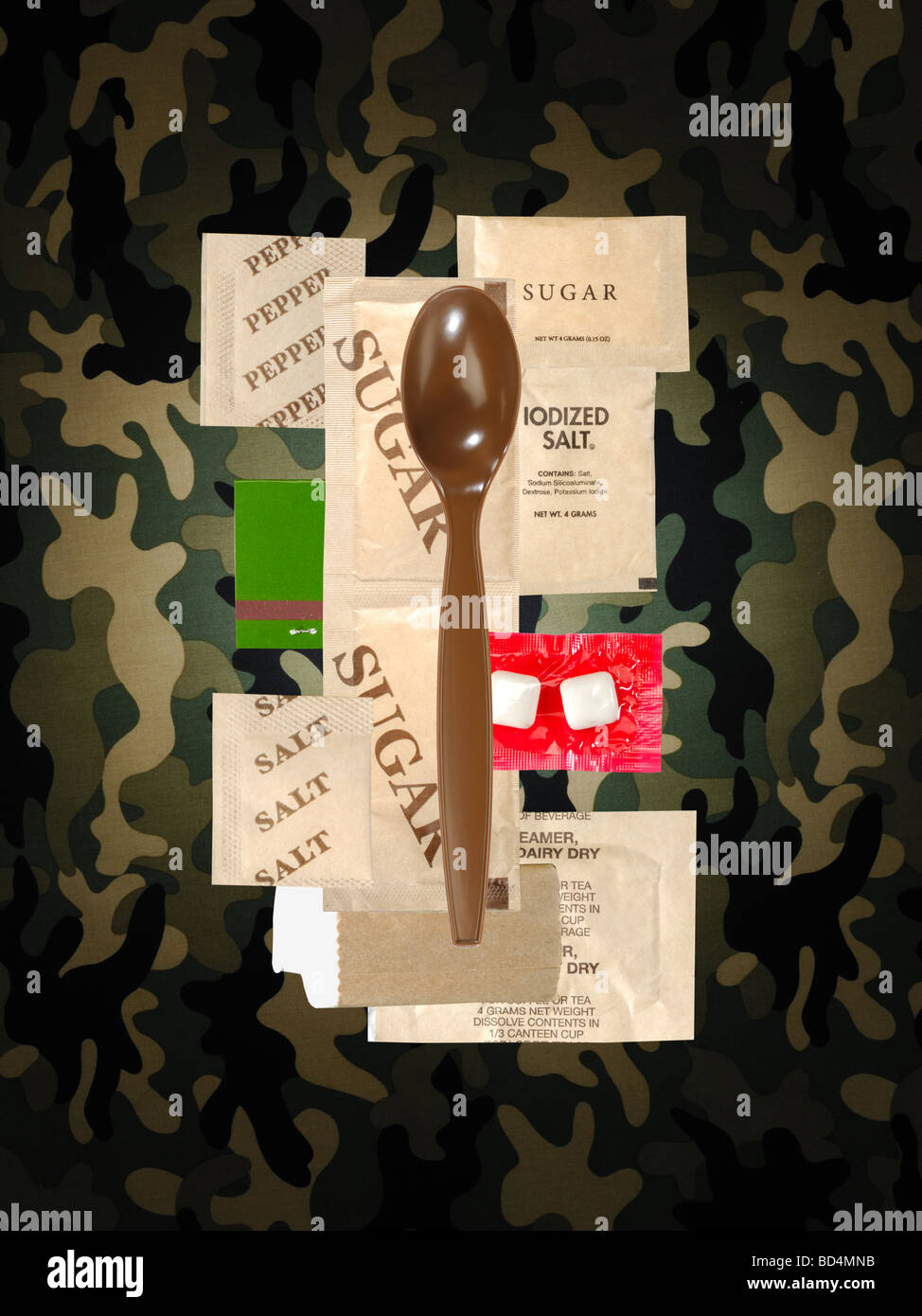 Military food ration packages with utensils on a background of ...