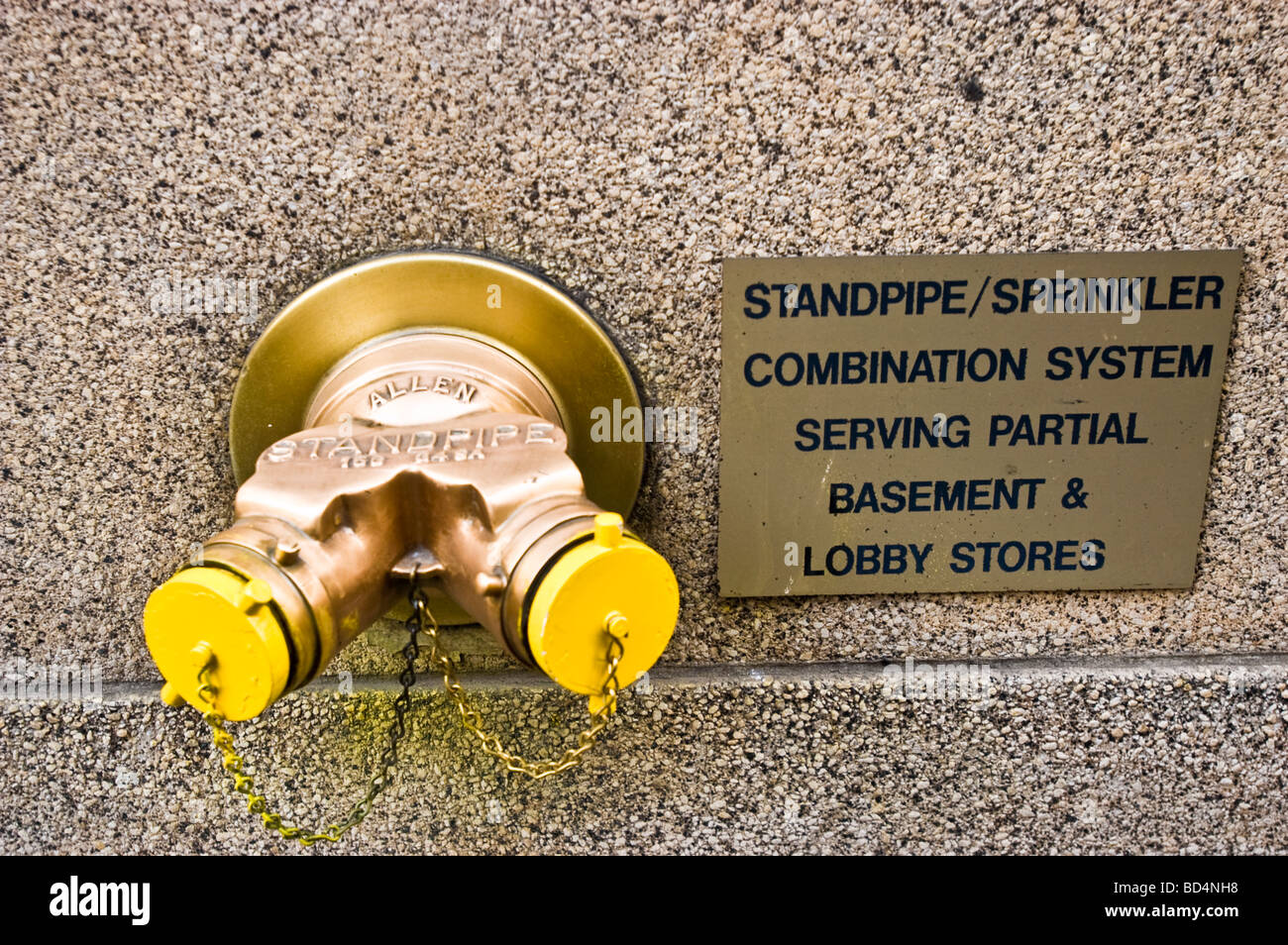 Metal standpipe sprinkler on the Manhattan wall, firefighter, New York ...