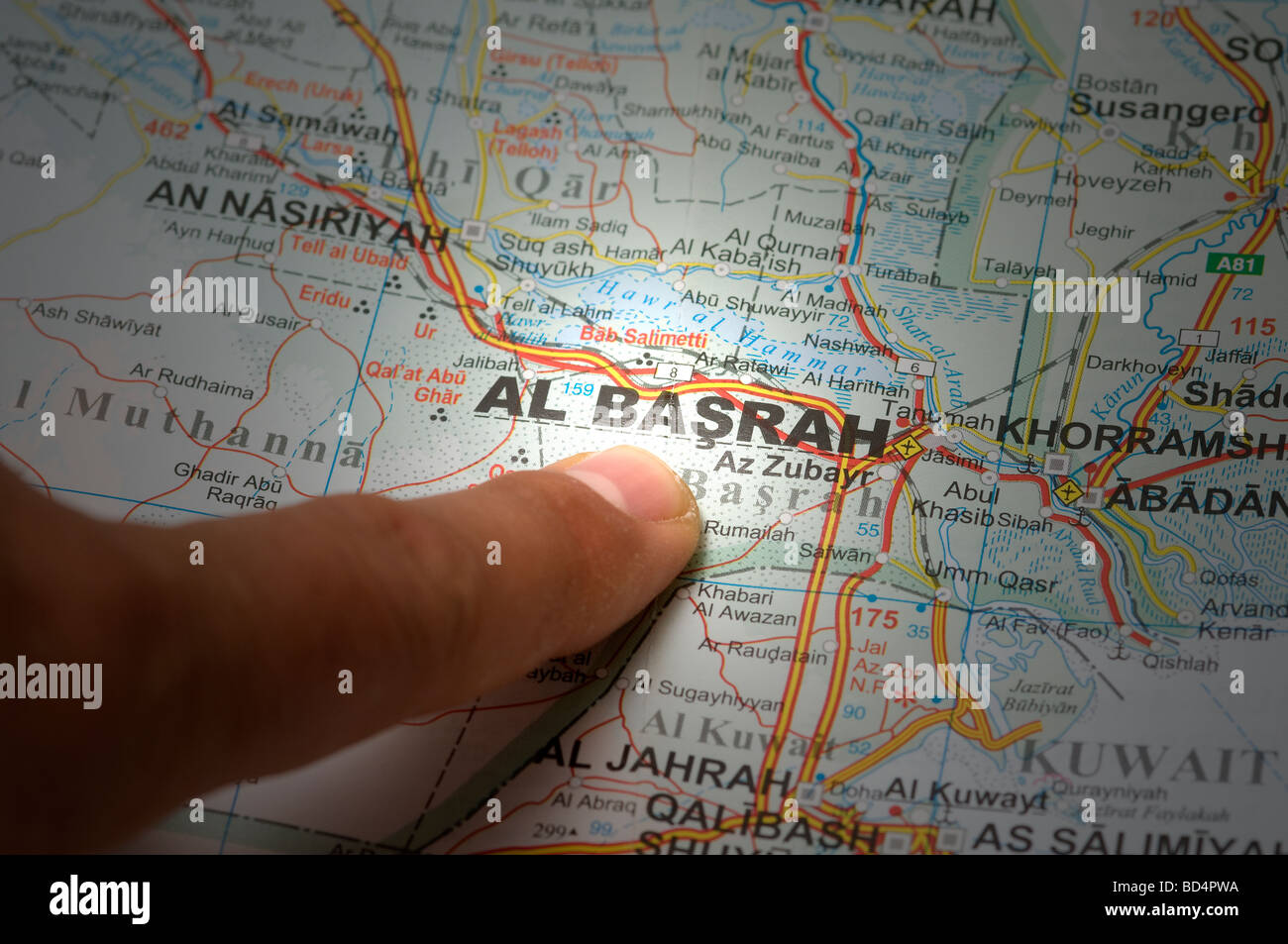 indicate with a finger the city of Bassora on a map Stock Photo - Alamy