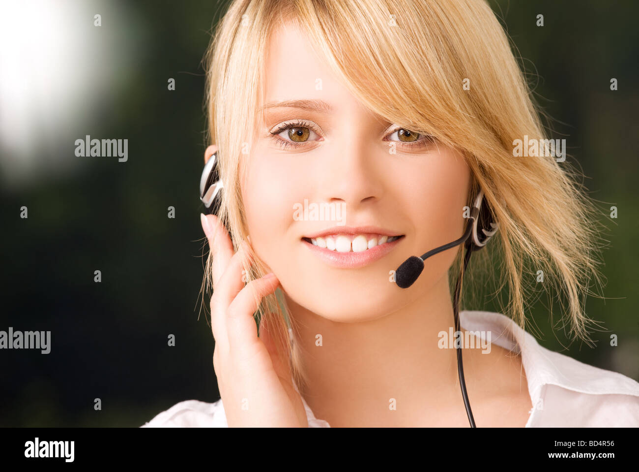 bright picture of friendly female helpline operator Stock Photo - Alamy