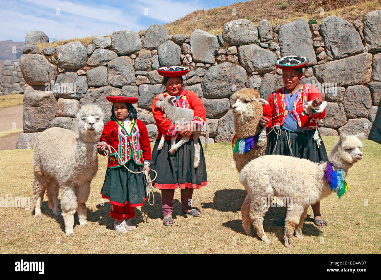native woman and girls with alpacas, Sacsayhuaman, Cuzco, Peru, South ...
