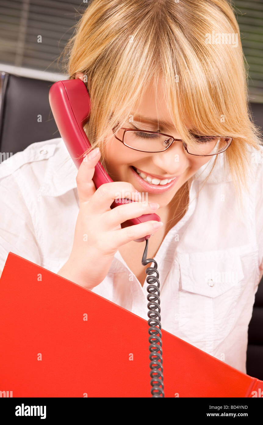 picture of lovely girl with phone in office Stock Photo - Alamy