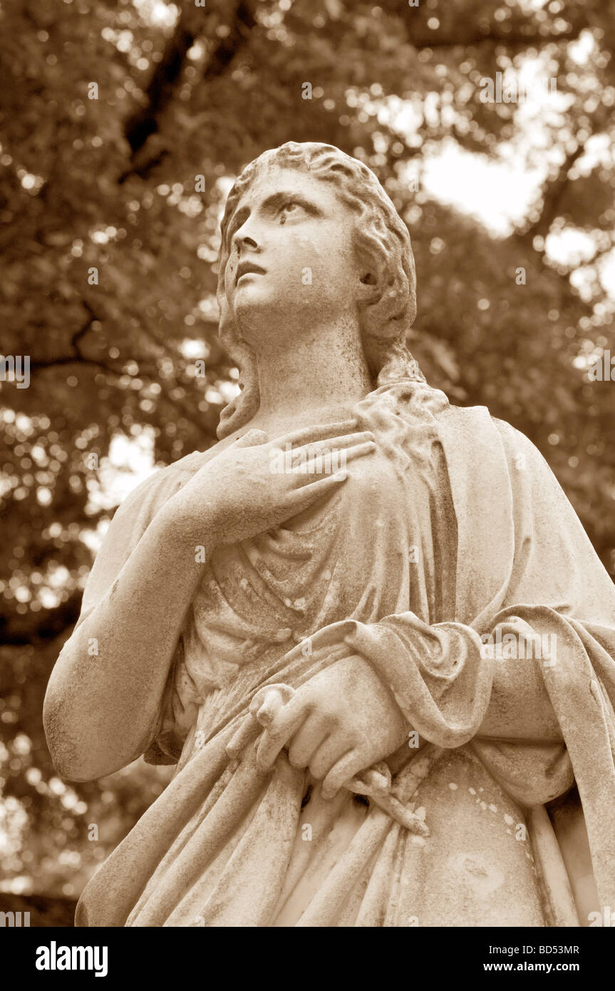 Eerie Cemetery statue of woman looking skyward toward the heavens Stock ...