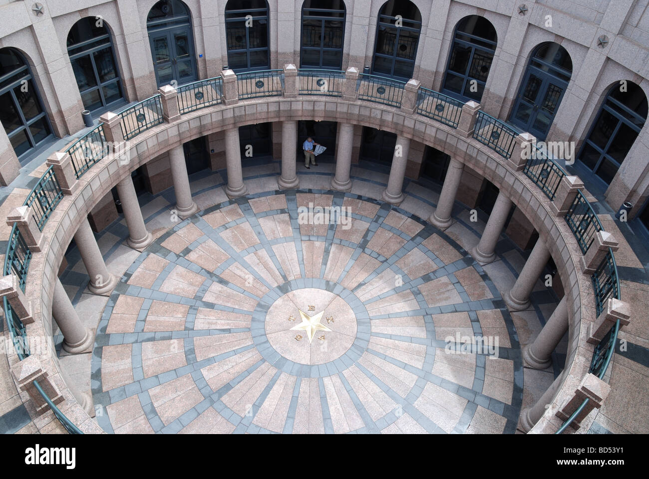 Person standing under rotunda Texas state capital building Austin Texas ...