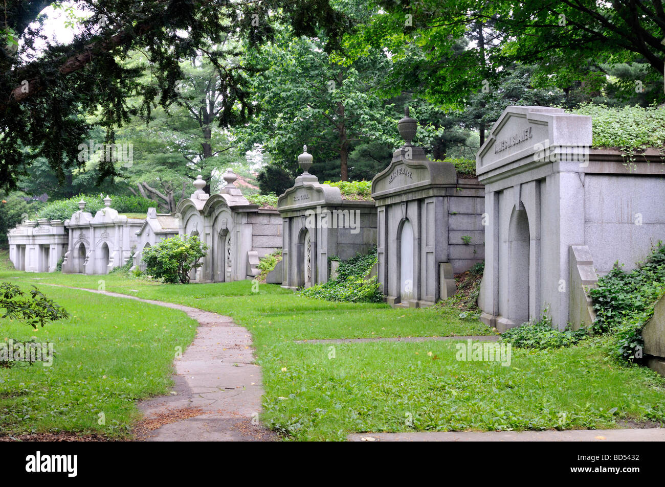 Row of old granite stone mausoleums in cemetery Stock Photo - Alamy
