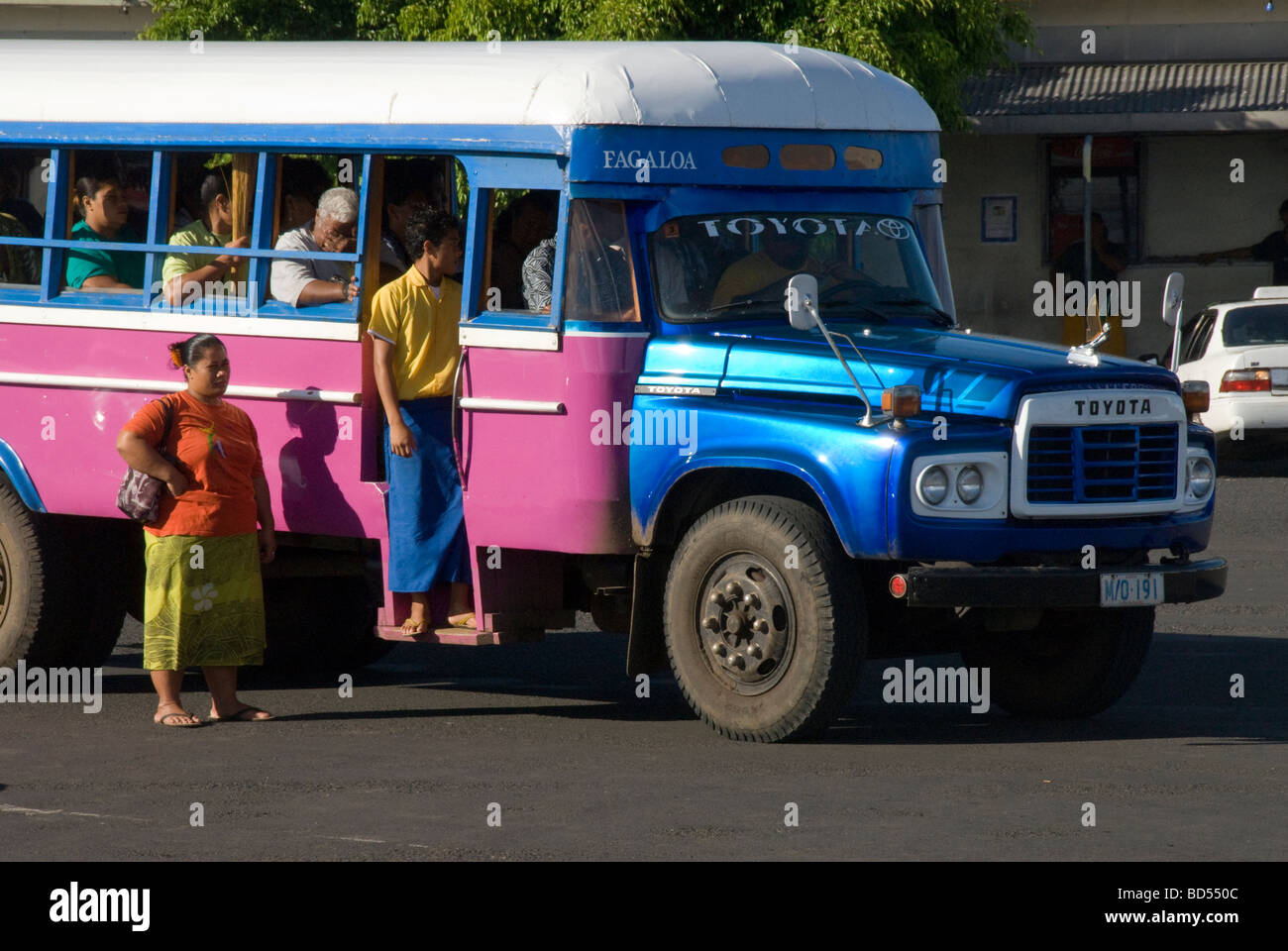 People on brightly coloured bus in Apia, Western Samoa Stock Photo - Alamy