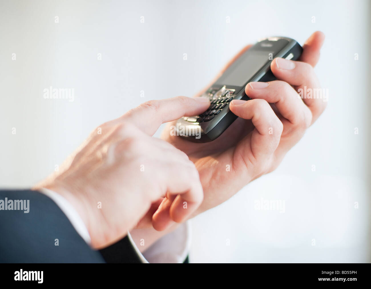 Businessman using personal digital assistant Stock Photo - Alamy