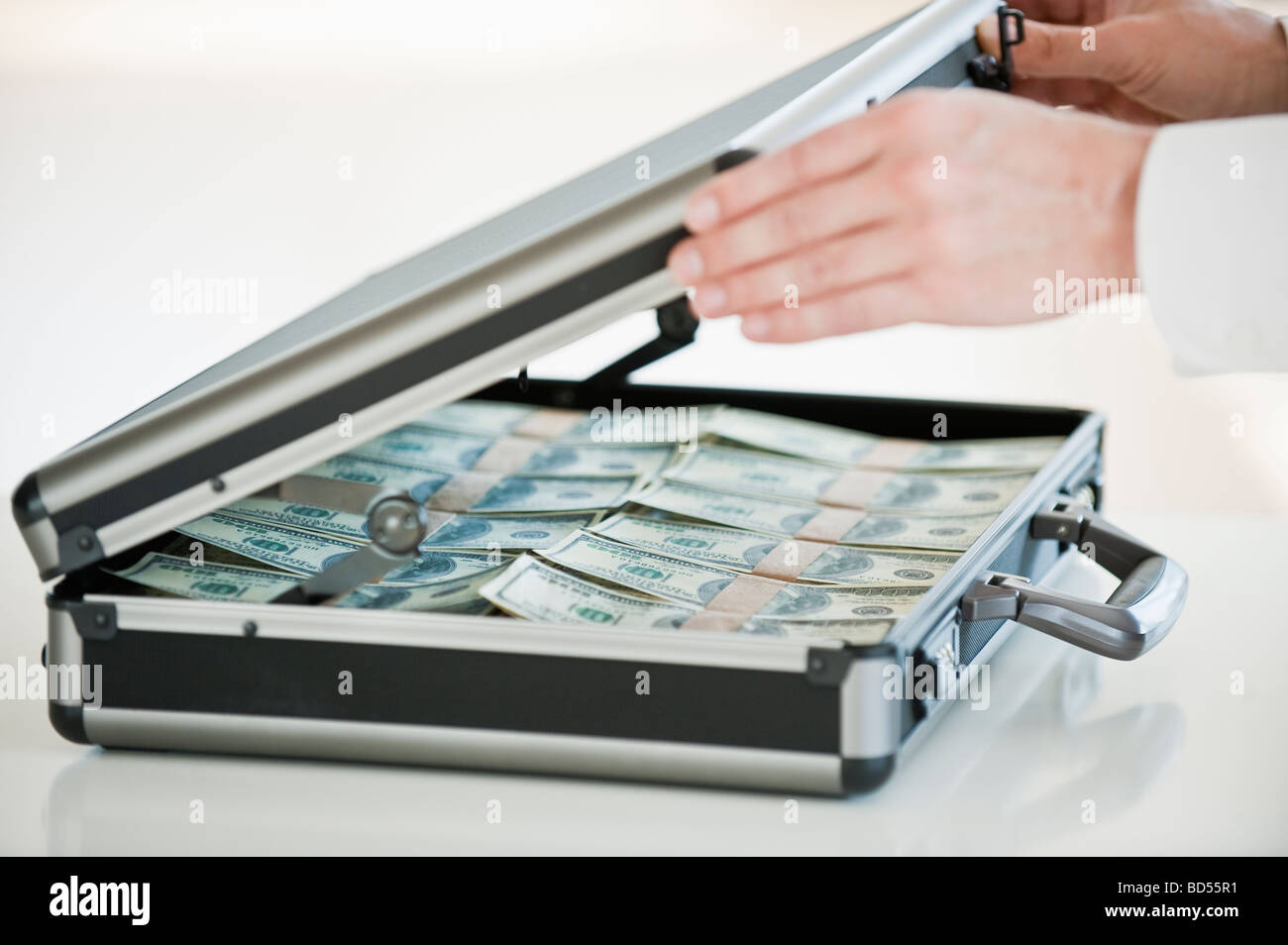Money briefcase hi-res stock photography and images - Alamy