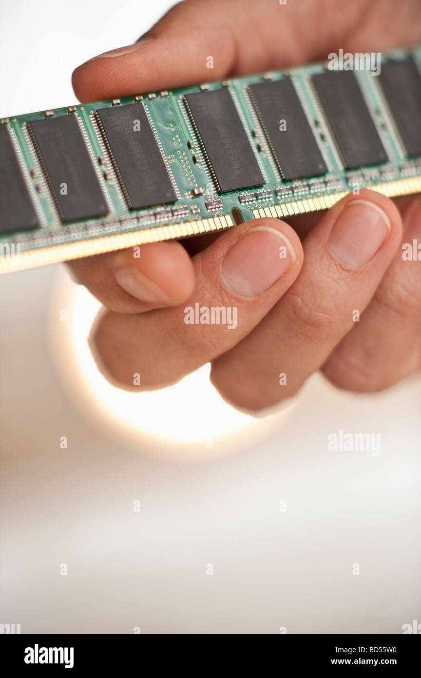 Hand holding computer chips Stock Photo - Alamy