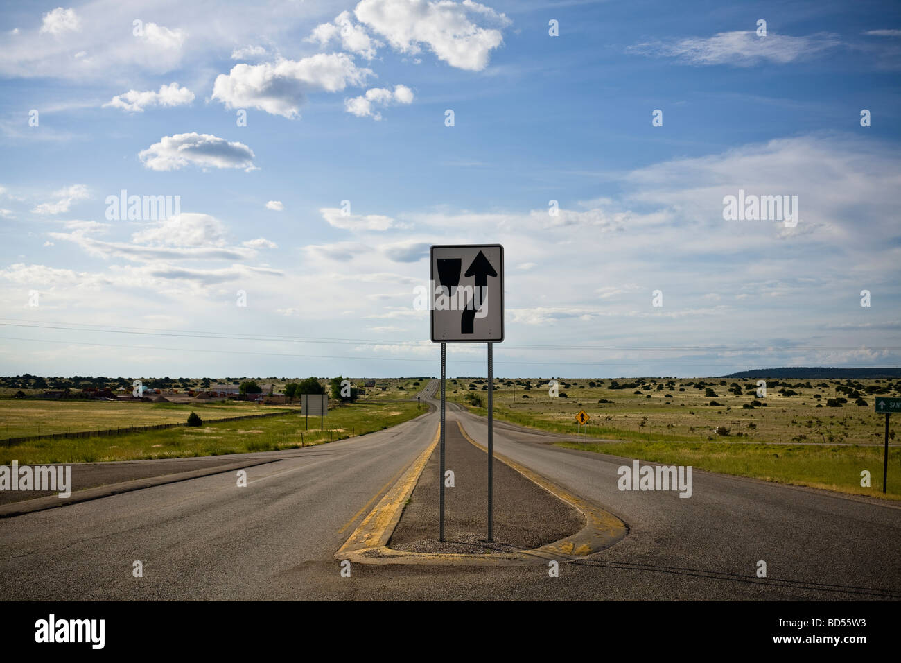 A road sign splits a highway in New Mexico in the American West Stock ...