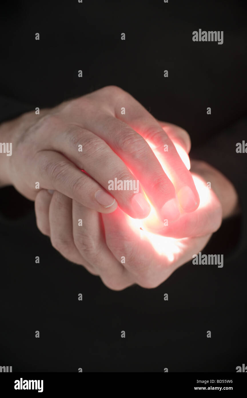 Hands holding a light Stock Photo - Alamy