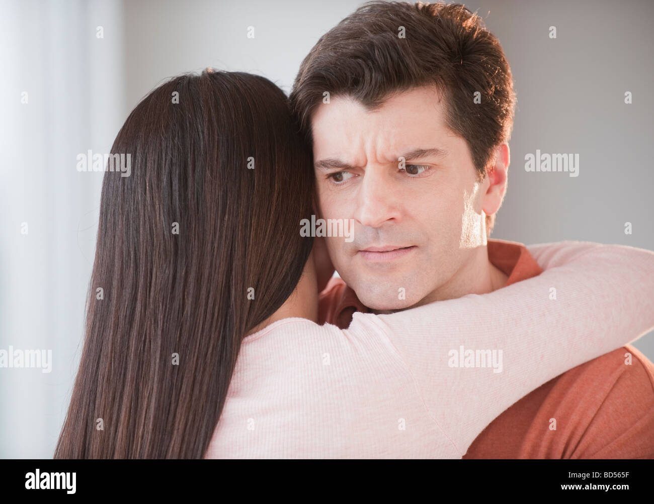 A couple hugging Stock Photo - Alamy