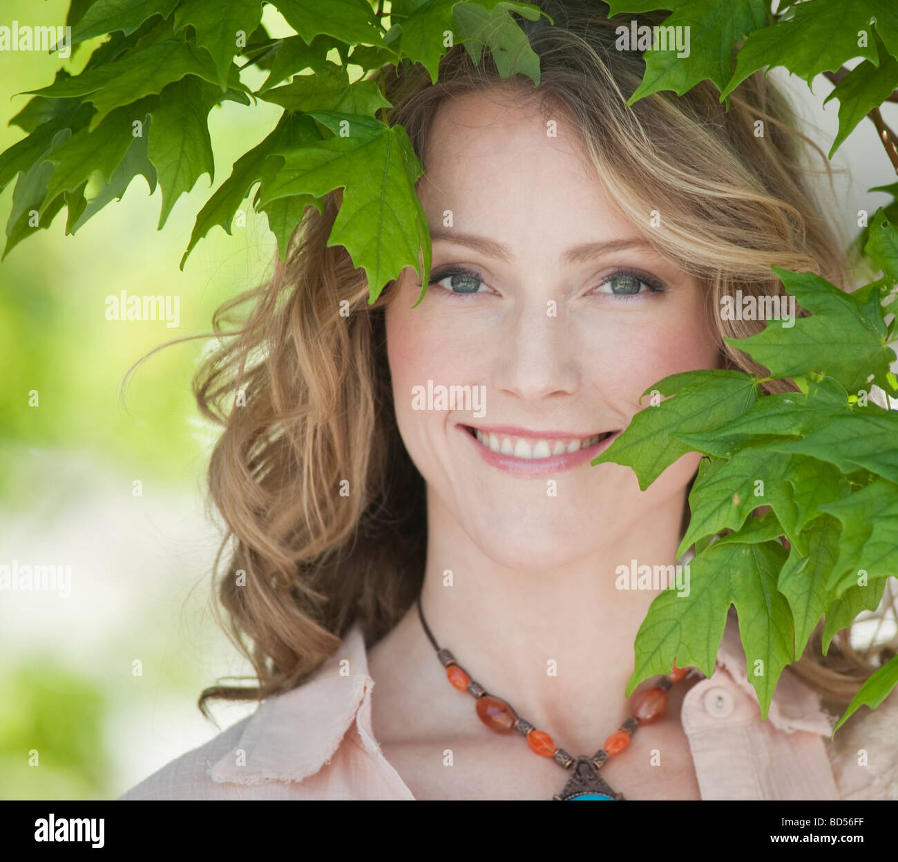 A woman outdoors surrounded in greenery Stock Photo - Alamy