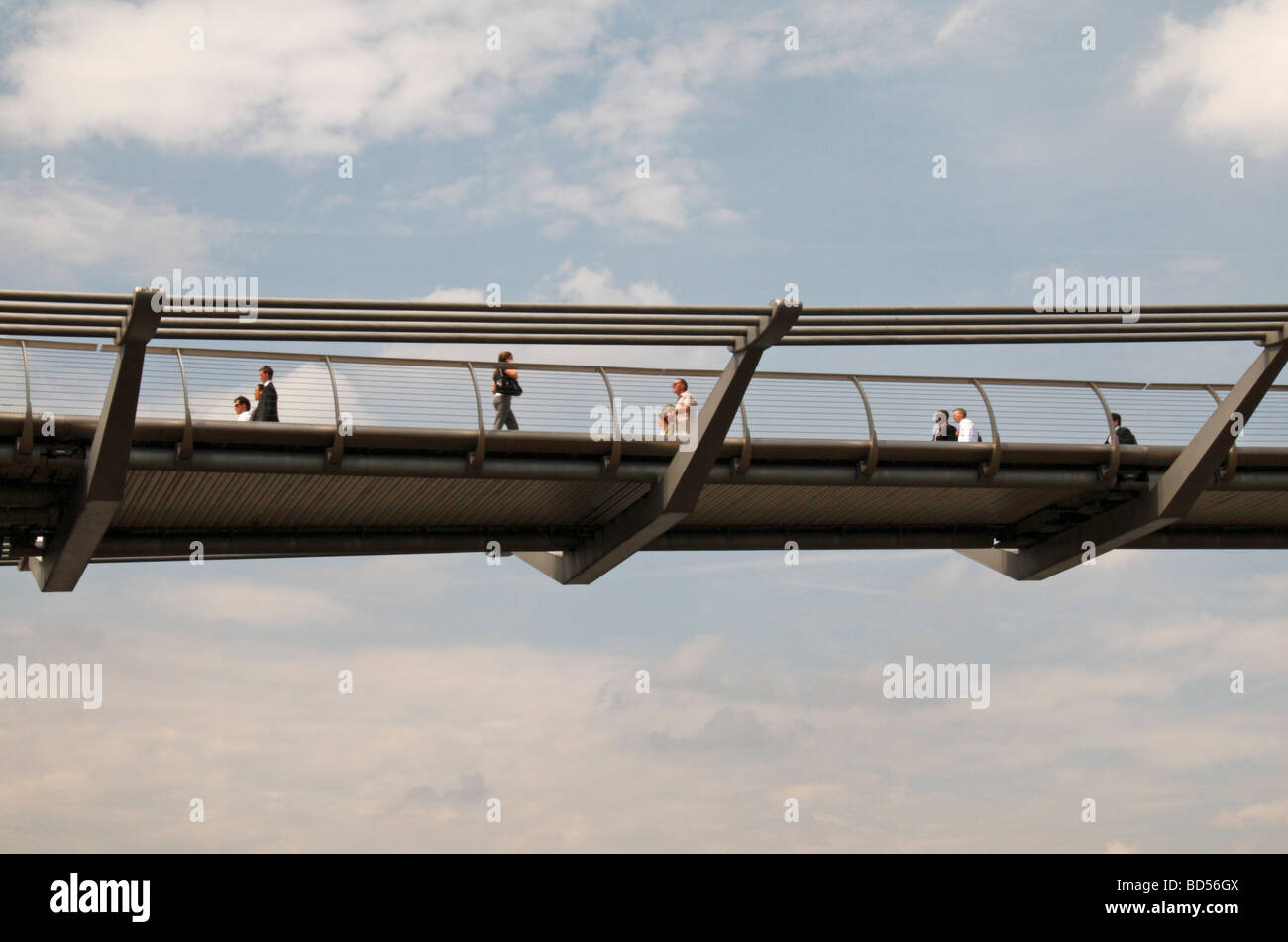 Crowds walking across pedestrian bridge hi-res stock photography and ...