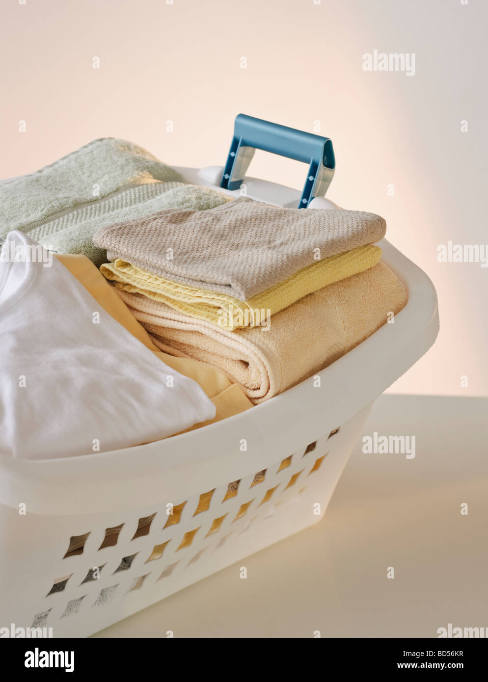 A laundry basket full of clothes Stock Photo - Alamy