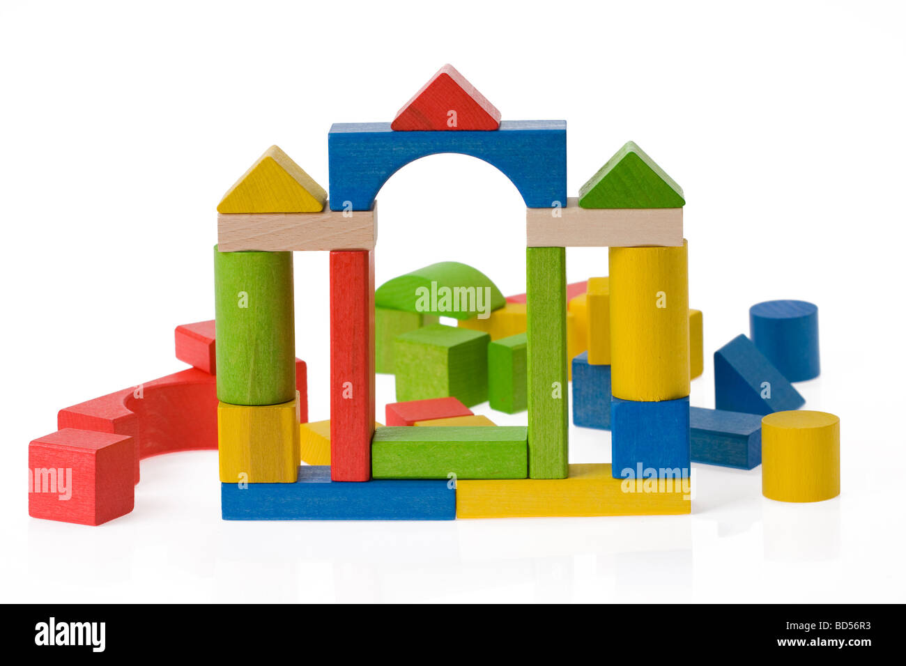 Wooden toy blocks on white background Stock Photo - Alamy