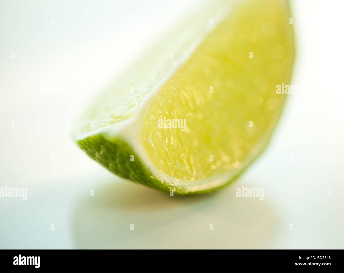 A lime wedge Stock Photo - Alamy