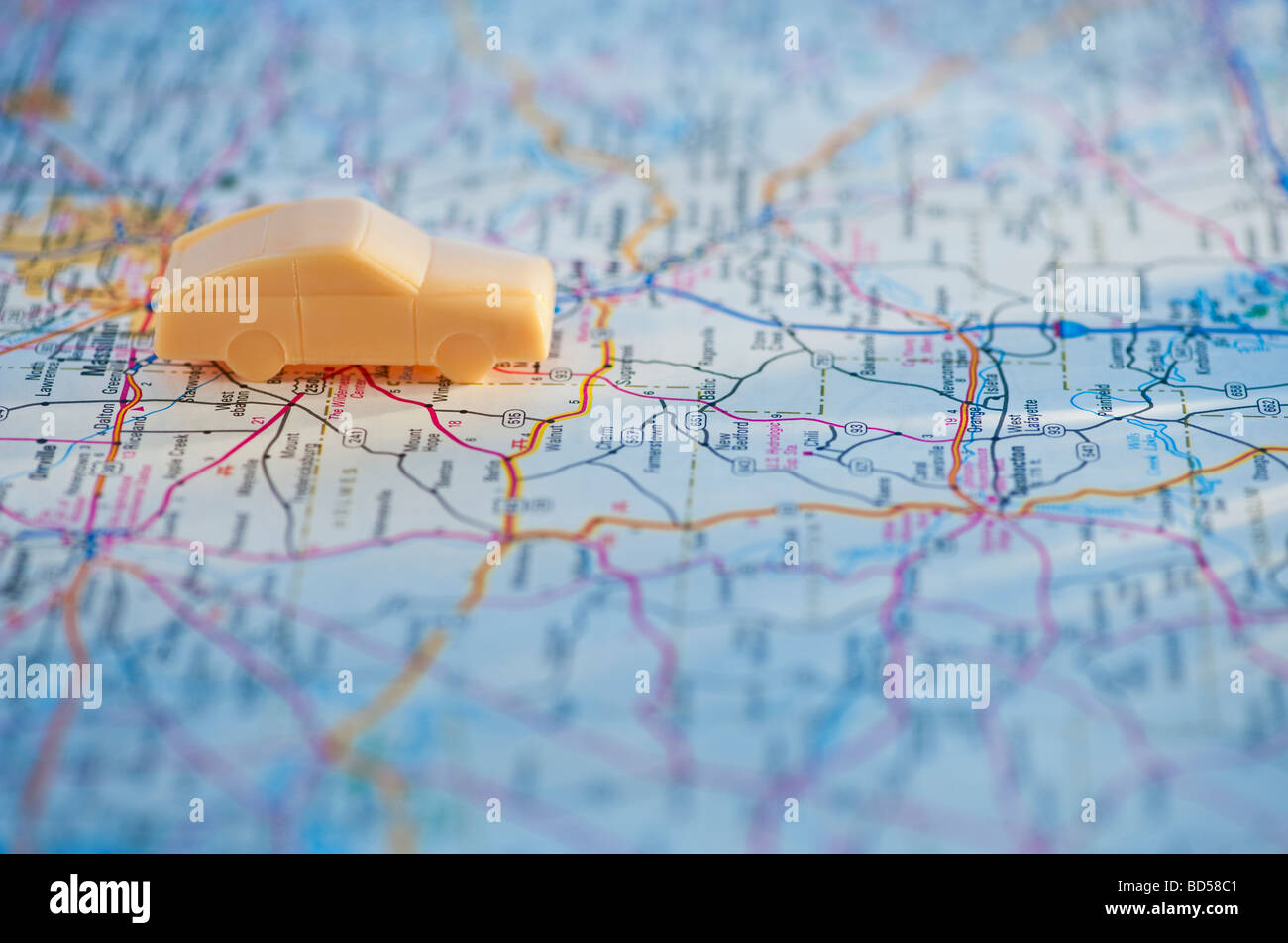 Toy car on a map Stock Photo - Alamy