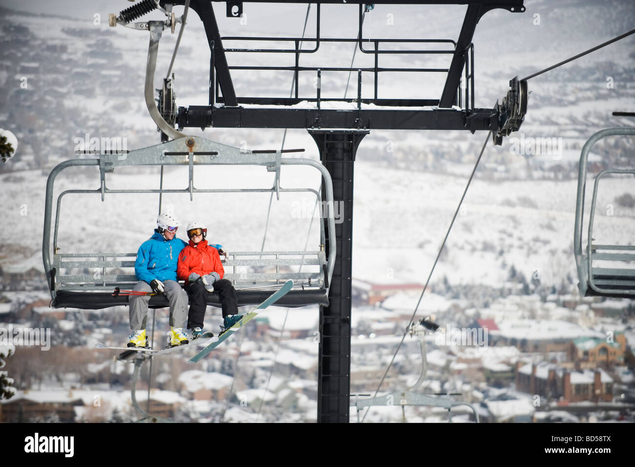 Skiers on a ski lift Stock Photo - Alamy