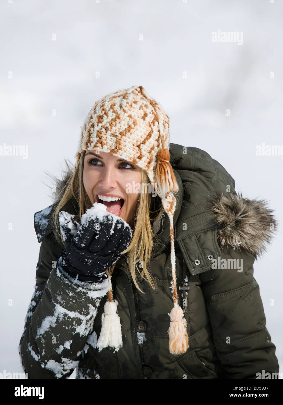 A woman eating snow Stock Photo - Alamy