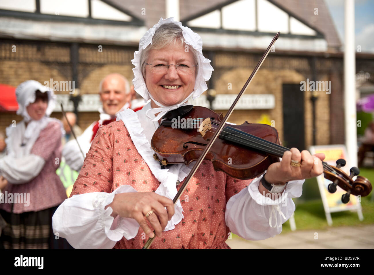 Woman playing fiddle violin for Traditional welsh folk dancers ...
